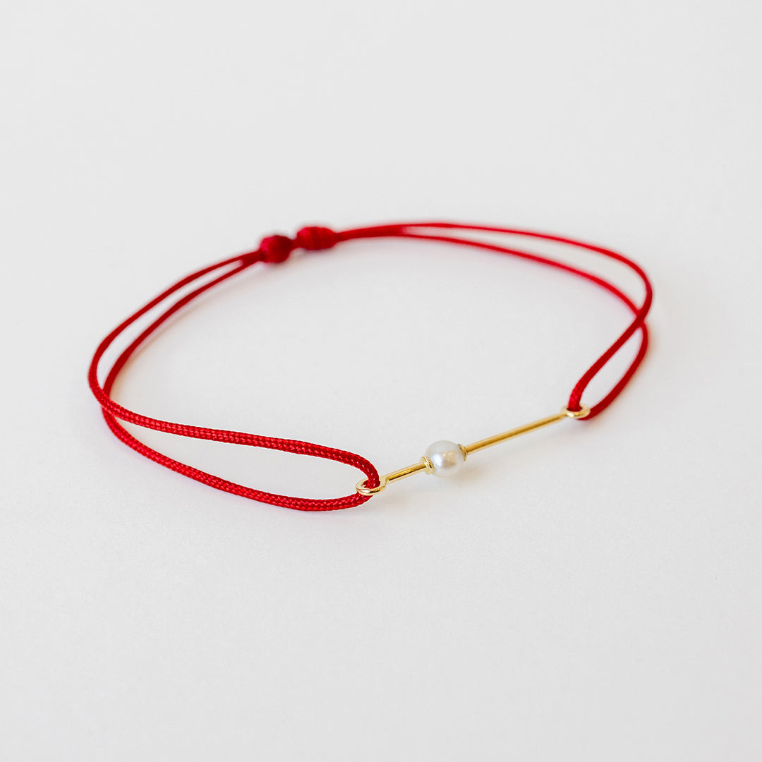 Pearl bracelet on thread – TinyOM